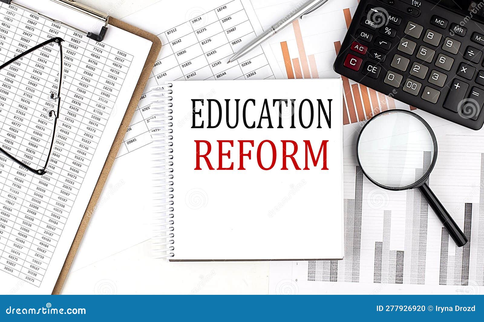 EDUCATION REFORM Text on Blue Background with Keyboard and Clipboard ...