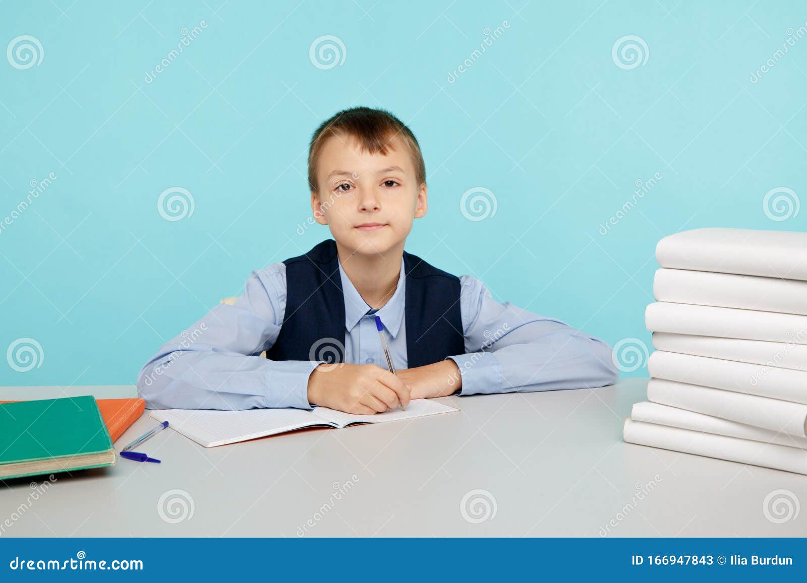 Education at School Concept. Boy Sitting at the Table and Studying ...