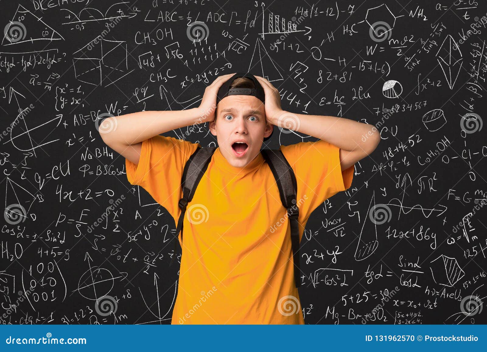 Shocked Student Standing by Blackboard with Math Formulas Stock Photo ...