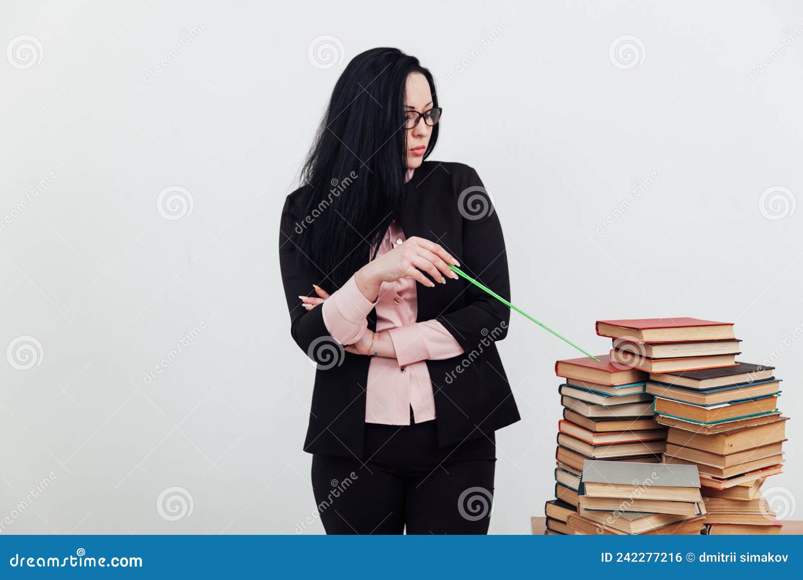 Education Teacher at the Table with Books in the University Library ...