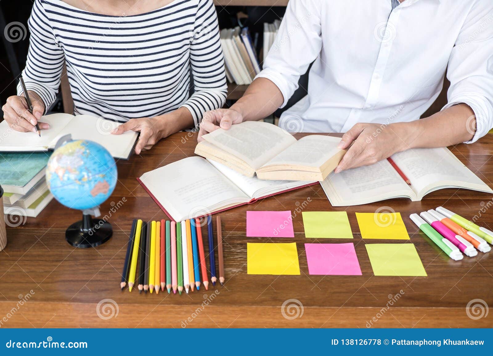 Education, Teaching, Learning Concept. Two High School Students or ...