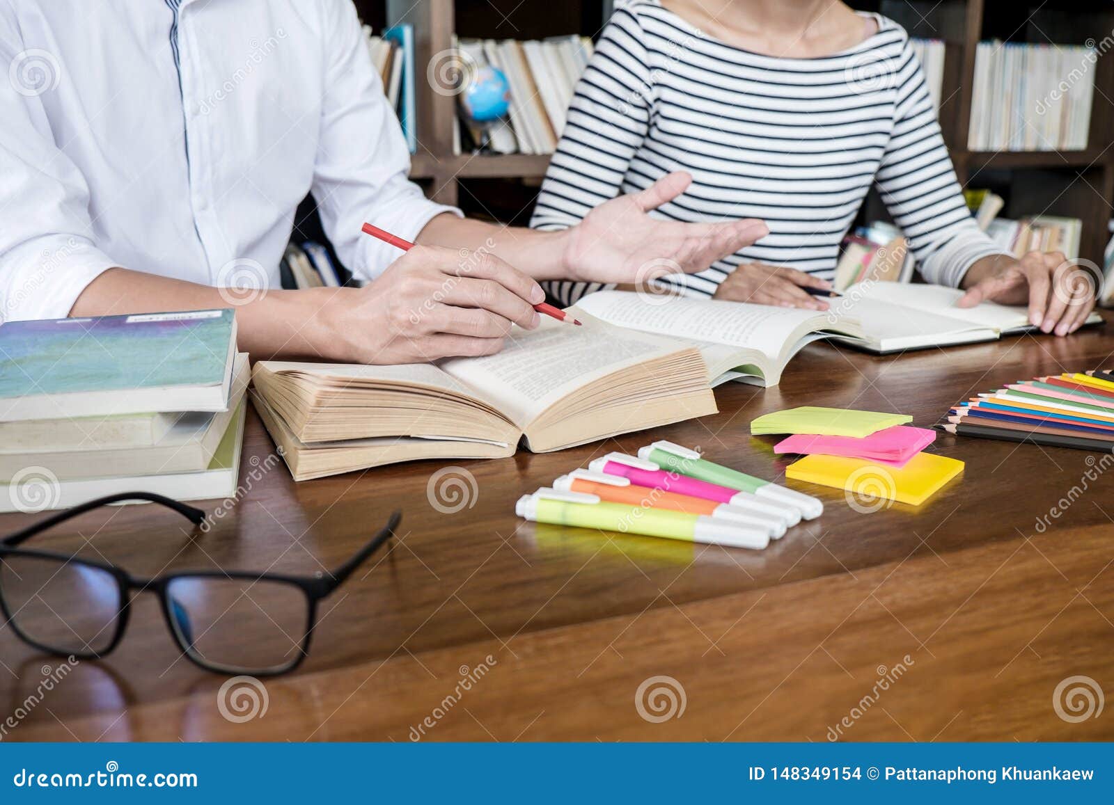 Education, Teaching, Learning Concept. Two High School Students or ...