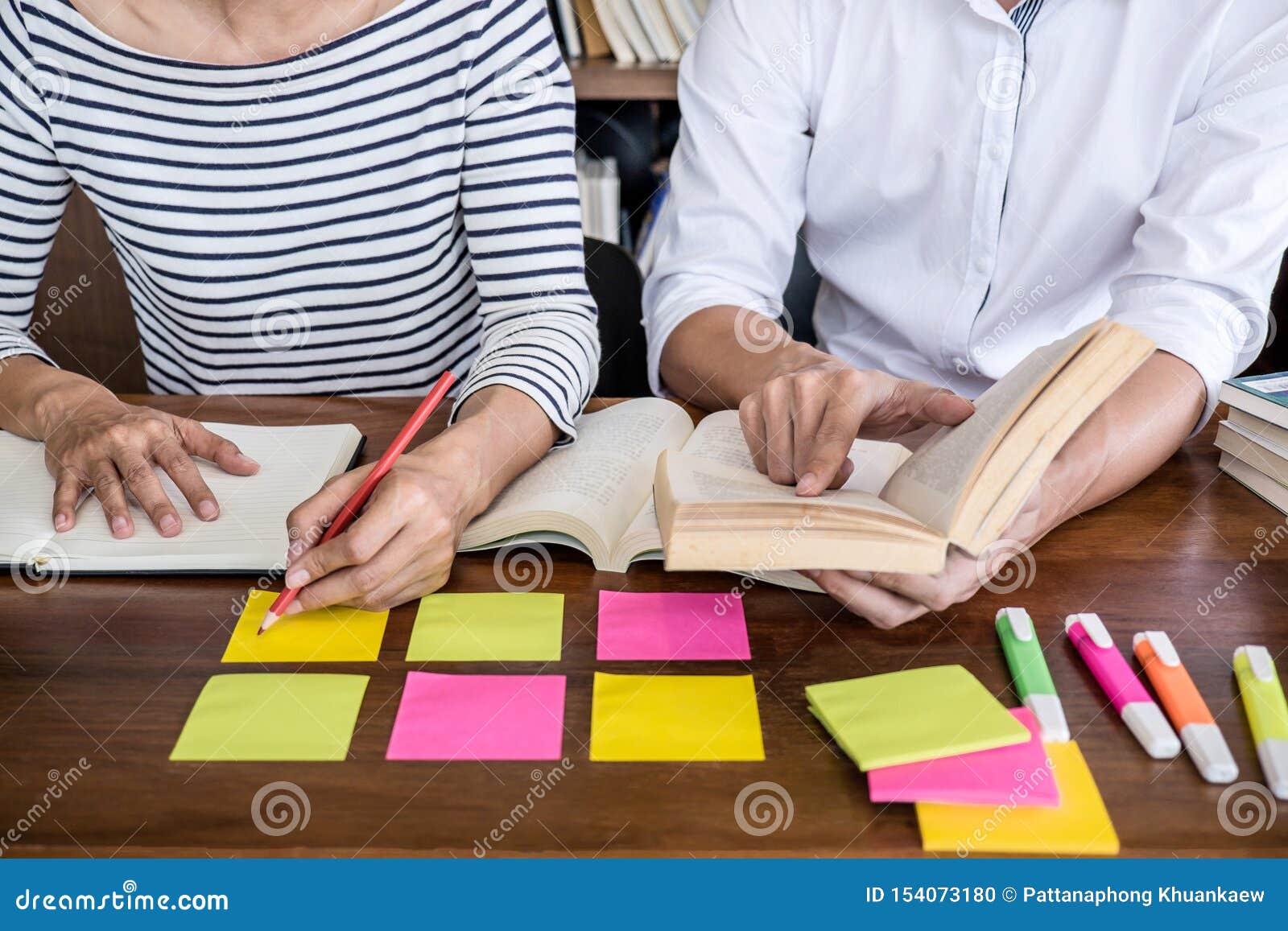 Education, Teaching, Learning Concept. Two High School Students or ...