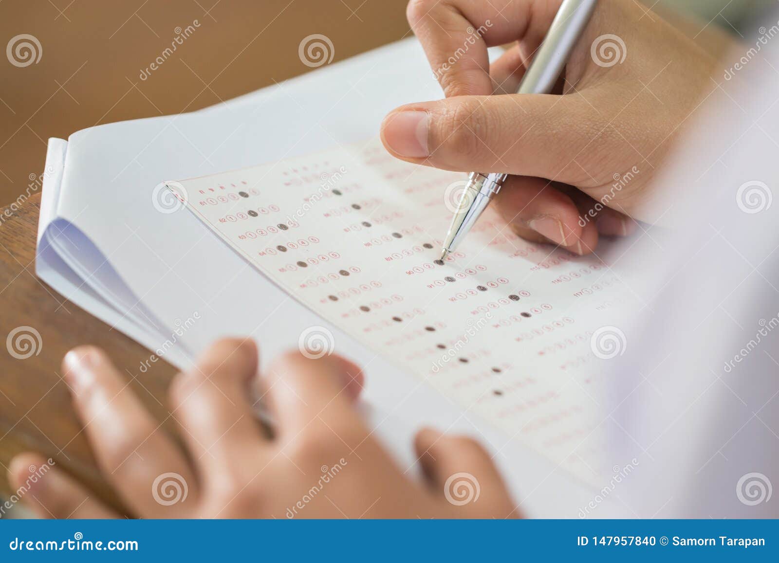 Education Test Concept : Blur of Hand Student Holding Pen for Testing ...