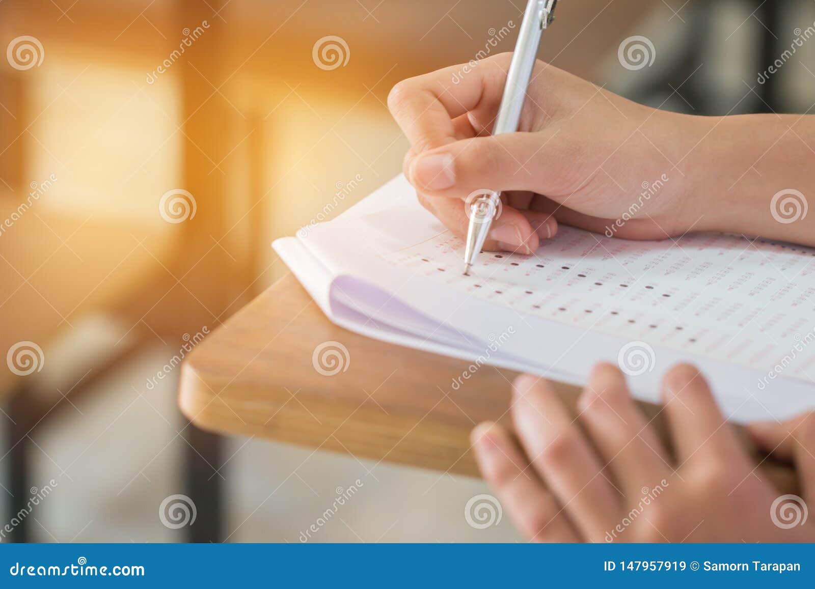 Education Test Concept : Blur of Hand Student Holding Pen for Testing ...
