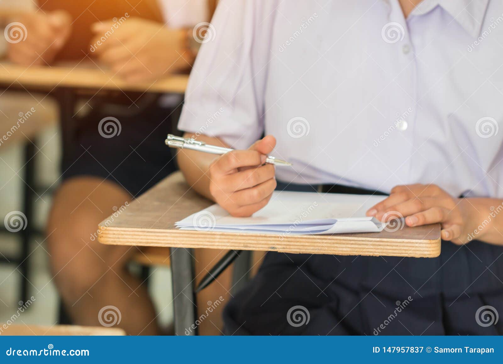 Education Test Concept : Hands Asian Students Thai Uniform Holding Pen ...
