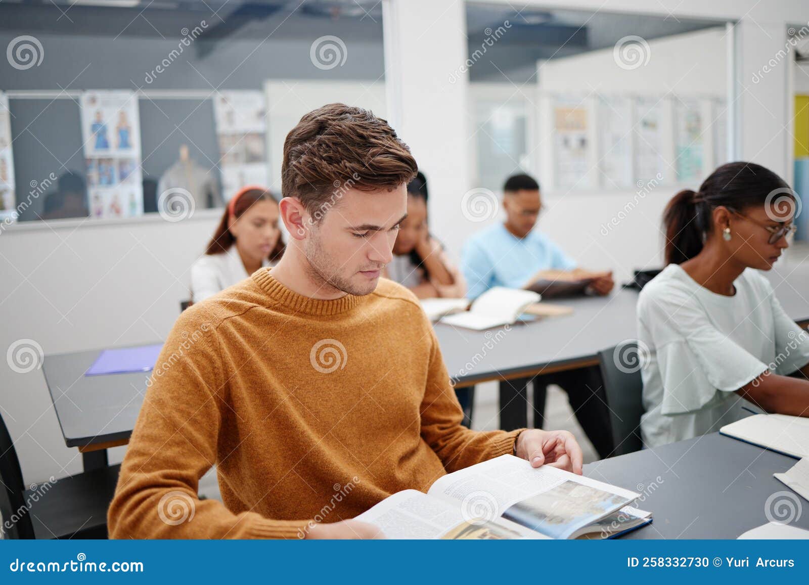 Education, University Student and Man Reading Book in Classroom ...