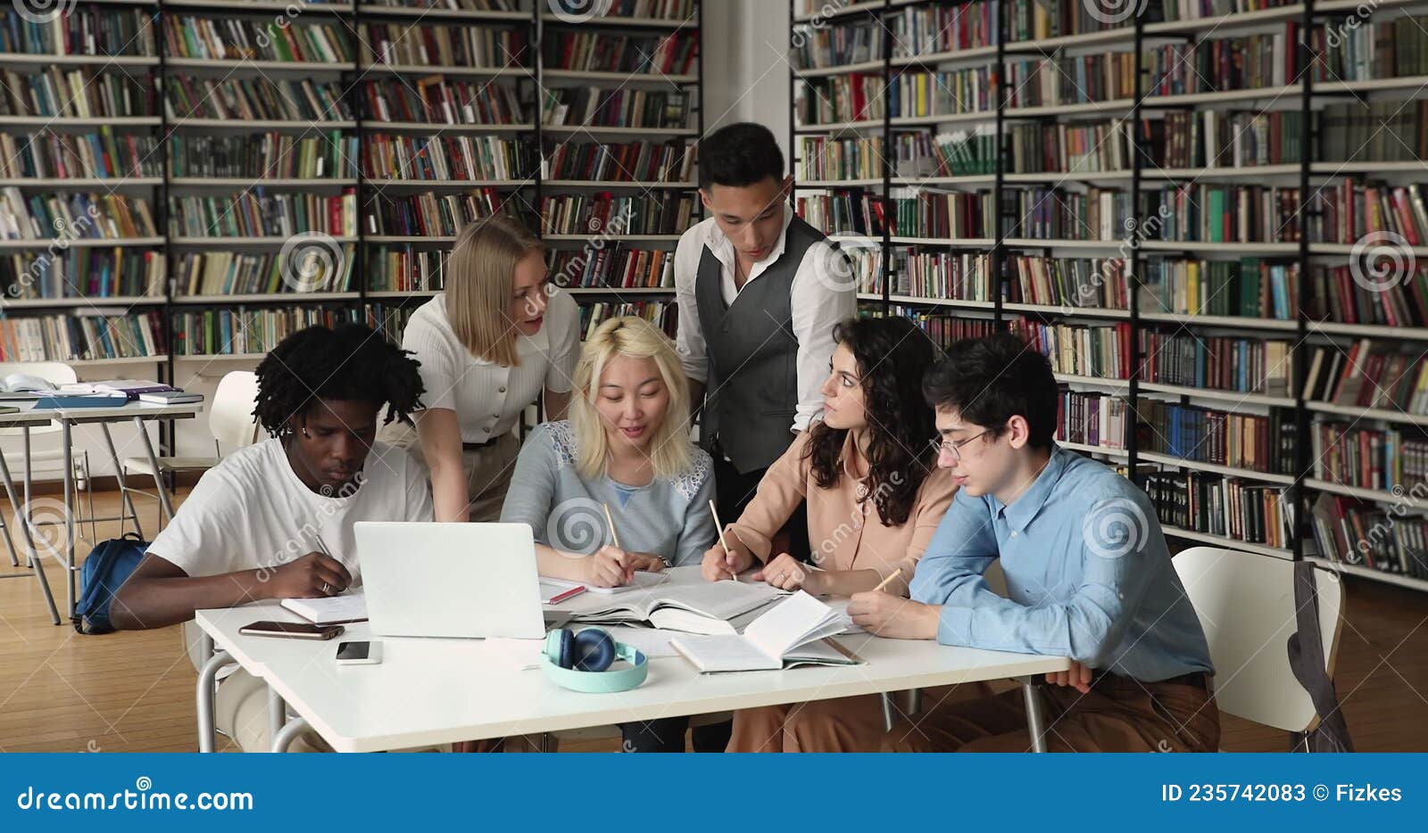 Students Gather in University Library Preparing Fox Exams Using Laptop ...