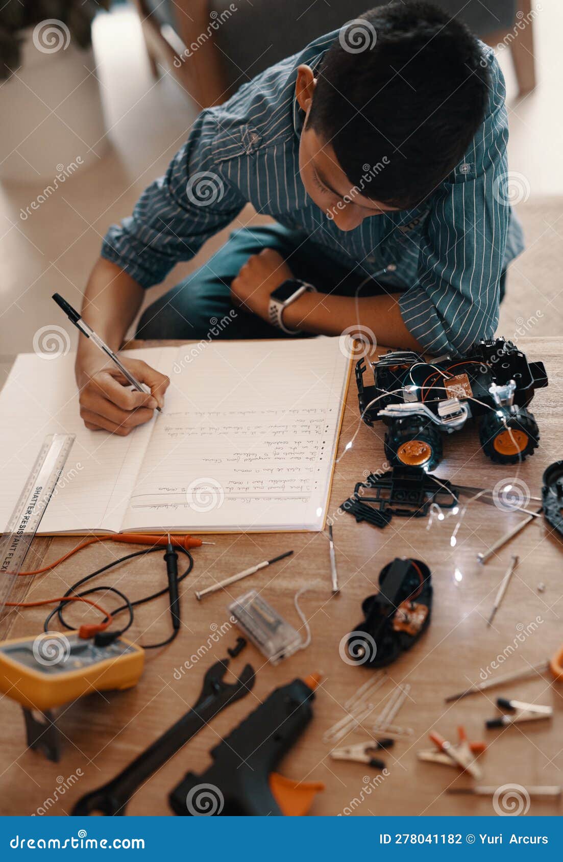 Education, Writing in Notebook and Kid with Robotics Homework ...