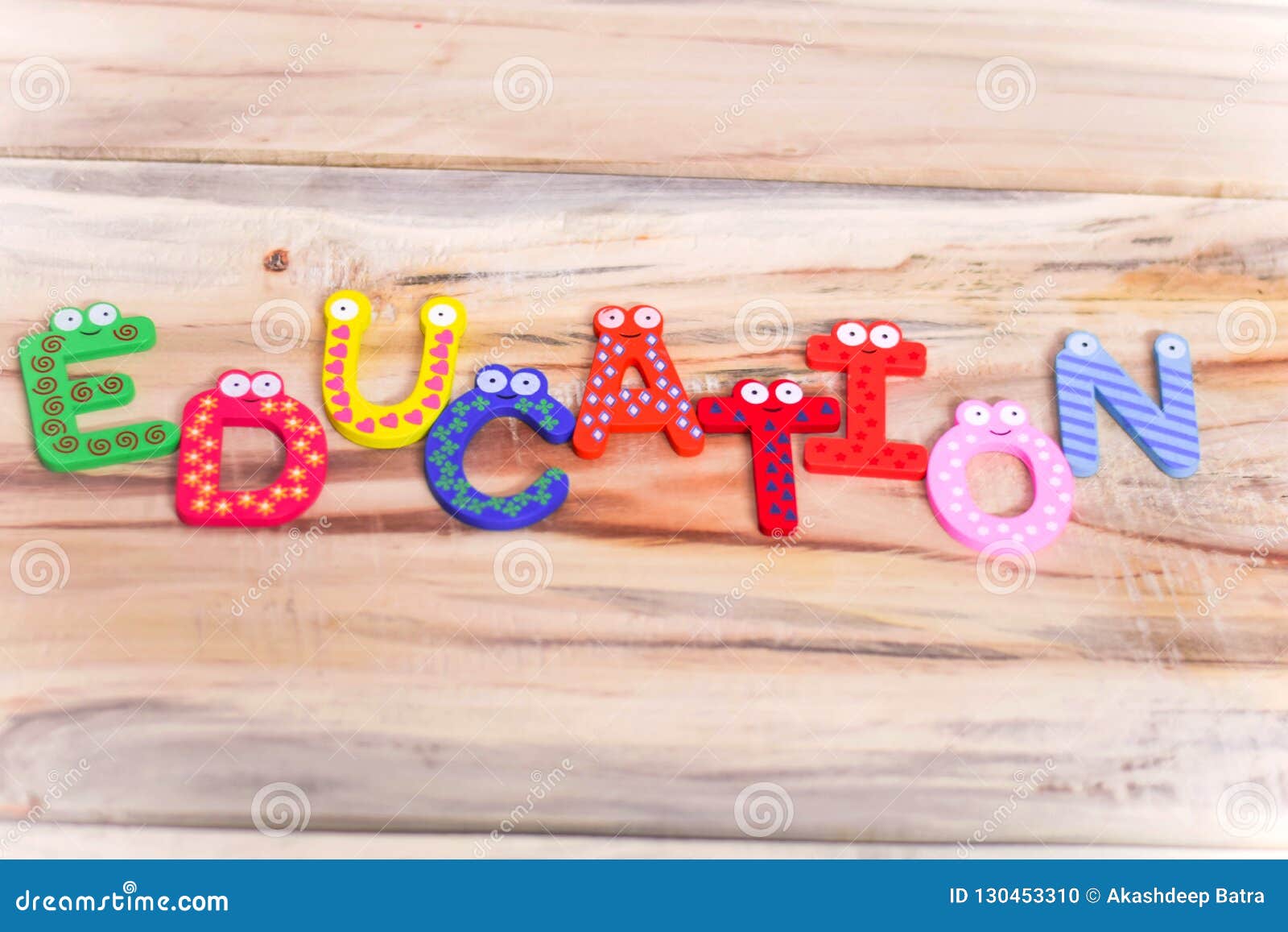 EDUCATION WRITTEN with BLOCK LETTERS on WOODEN TABLE Stock Photo ...