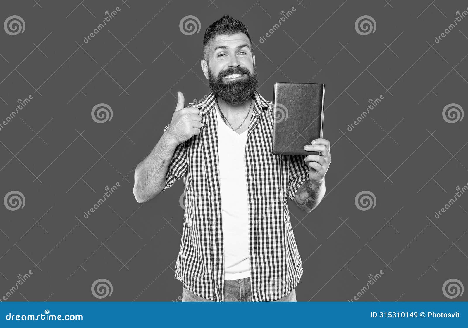 Educational Concept. Cheerful Bearded Man Recommend Book on Grey ...