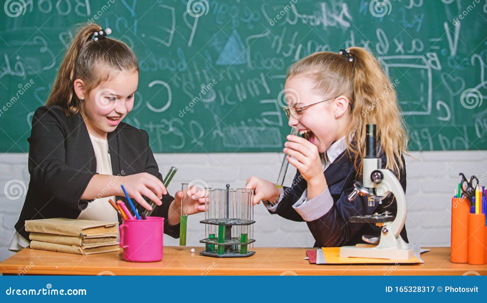 Educational Experiment Concept. Microscope and Test Tubes on Table. Be ...