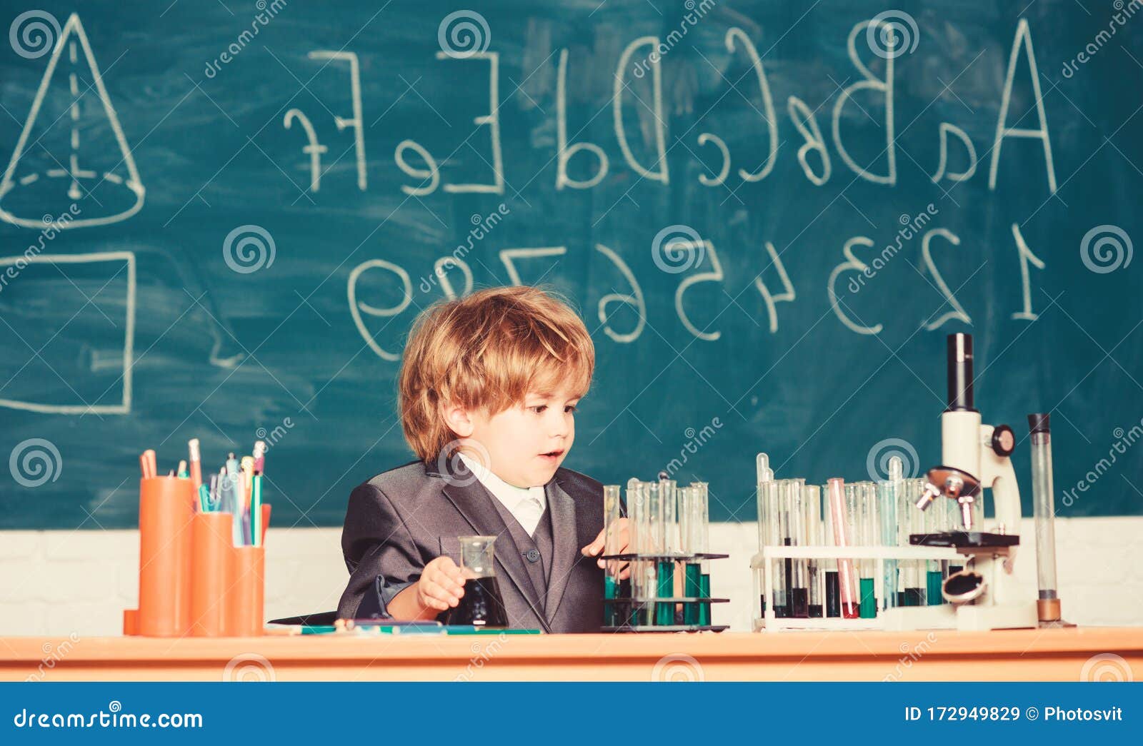 Educational Experiment. Happy Childhood. Boy Near Microscope and Test ...