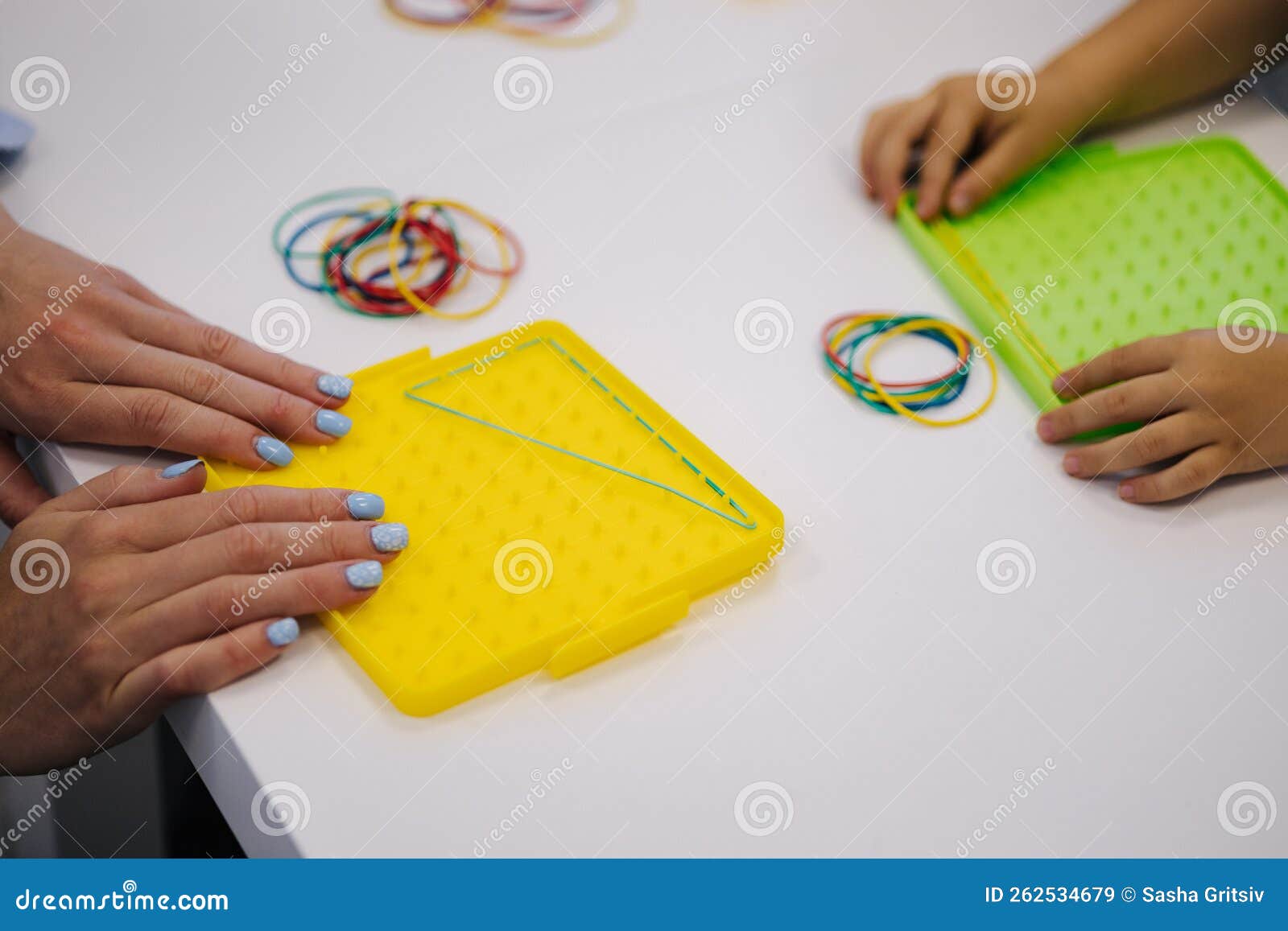 Educational Games in Kindergarden. Children Play Using Rubber Bands ...
