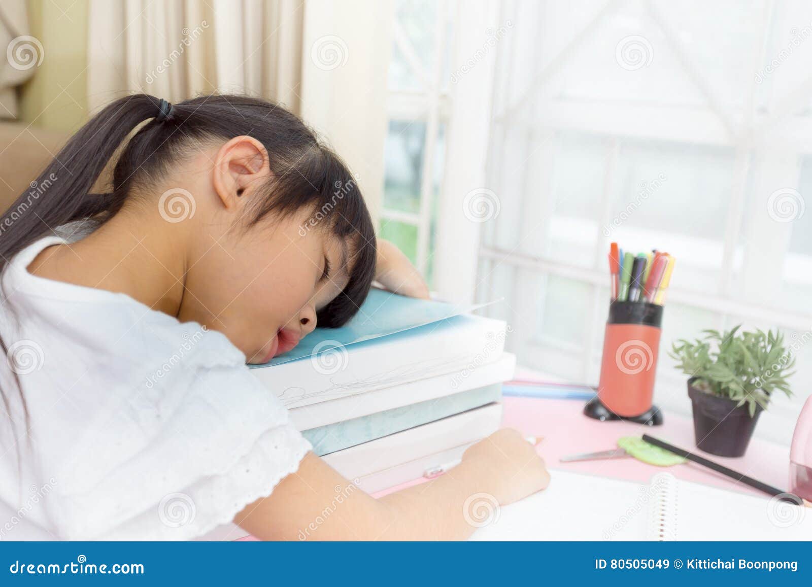Educational Theme: Schoolgirl Sleeping on Her Textbooks in Home Stock ...