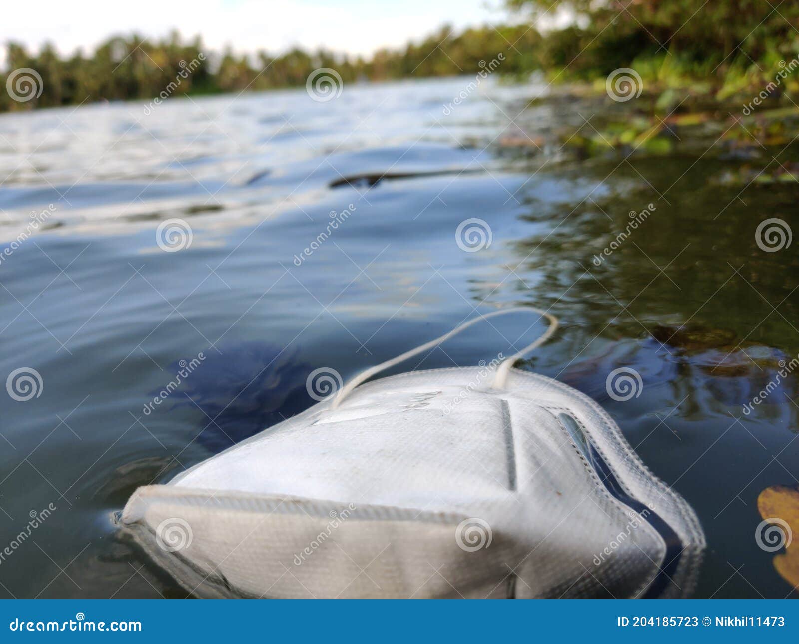 After Effect of COVID N 95 Face Mask Floating on the Surface of Water ...