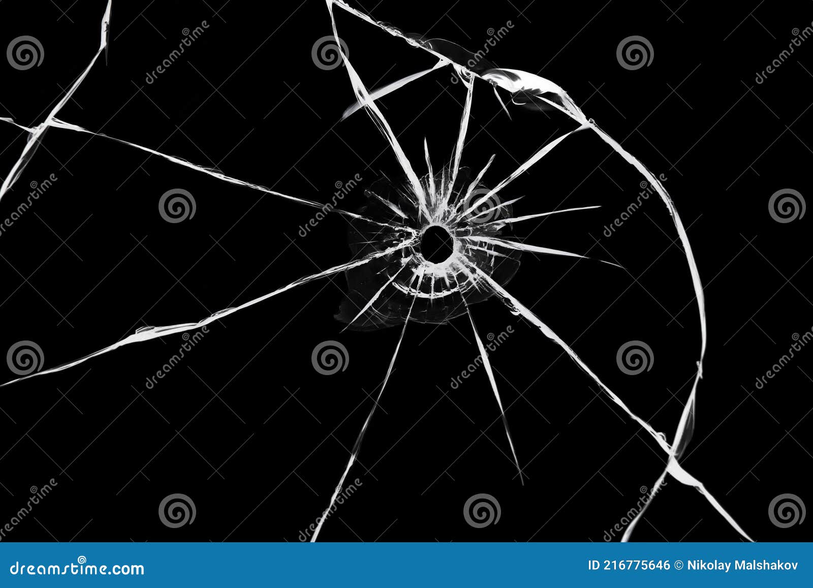 The Effect of Cracks on Broken Glass from a Shot of a Weapon. a Hole in ...
