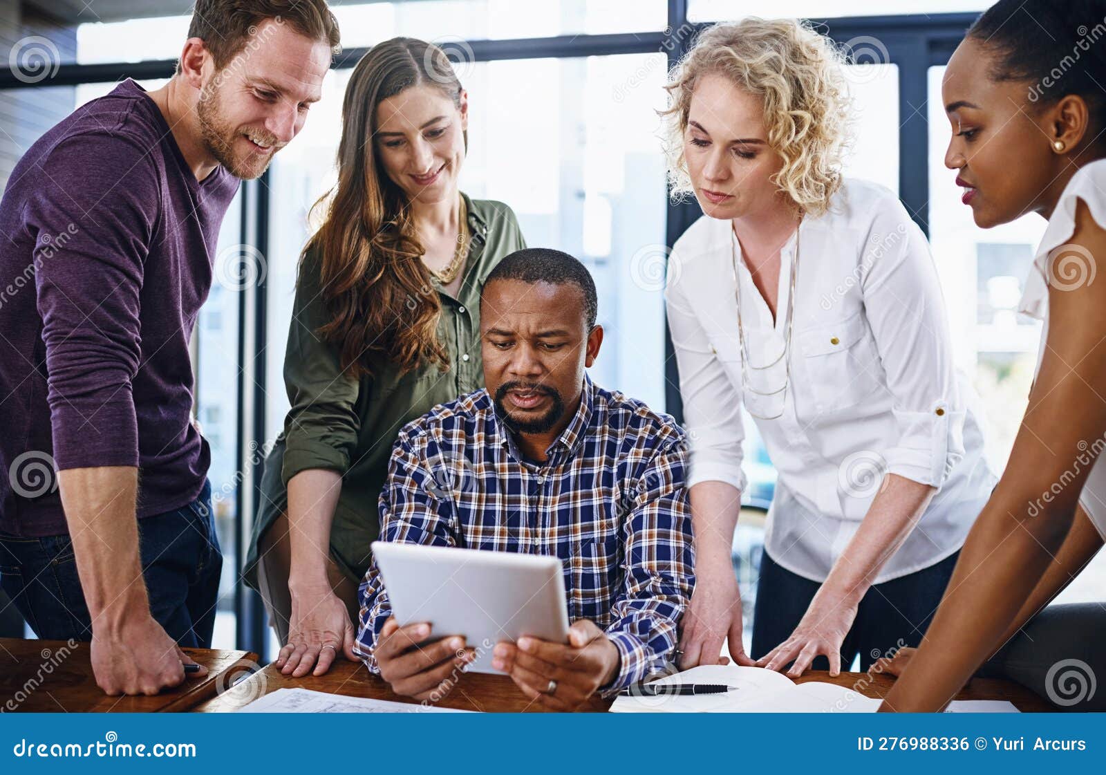 Efficiency is Increased through Teamwork. a Team of Designers Working ...