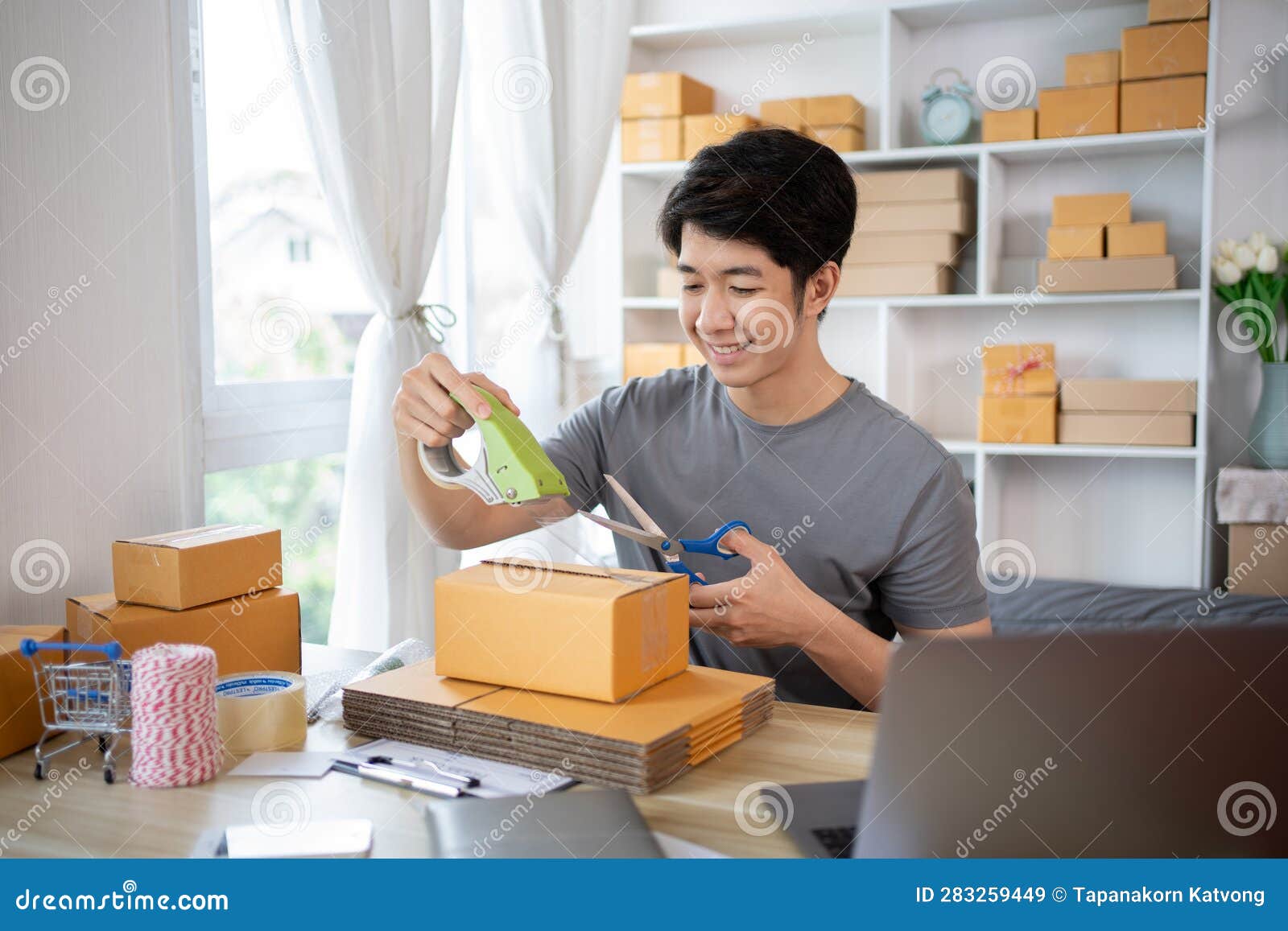 Efficient Home-Based Delivery, Man Packing Items into Post Box for ...