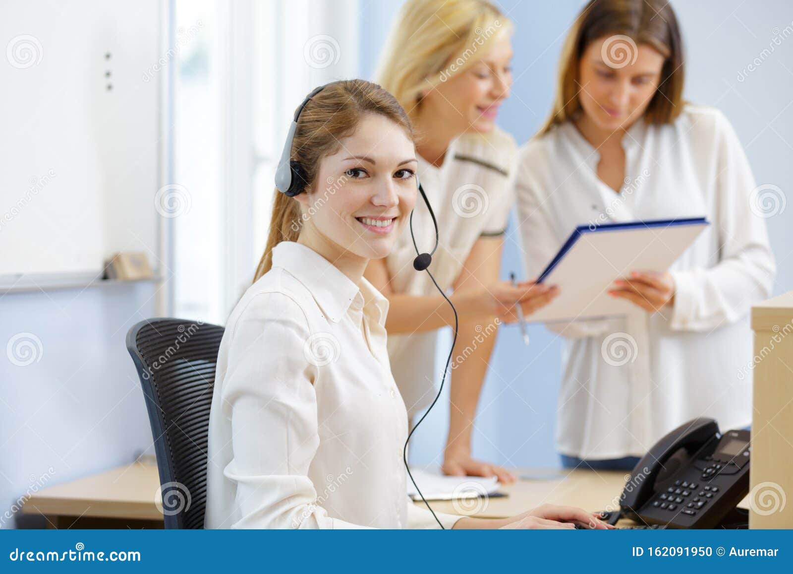 Efficient Smiling Secretary Looking at Camera Stock Photo - Image of ...