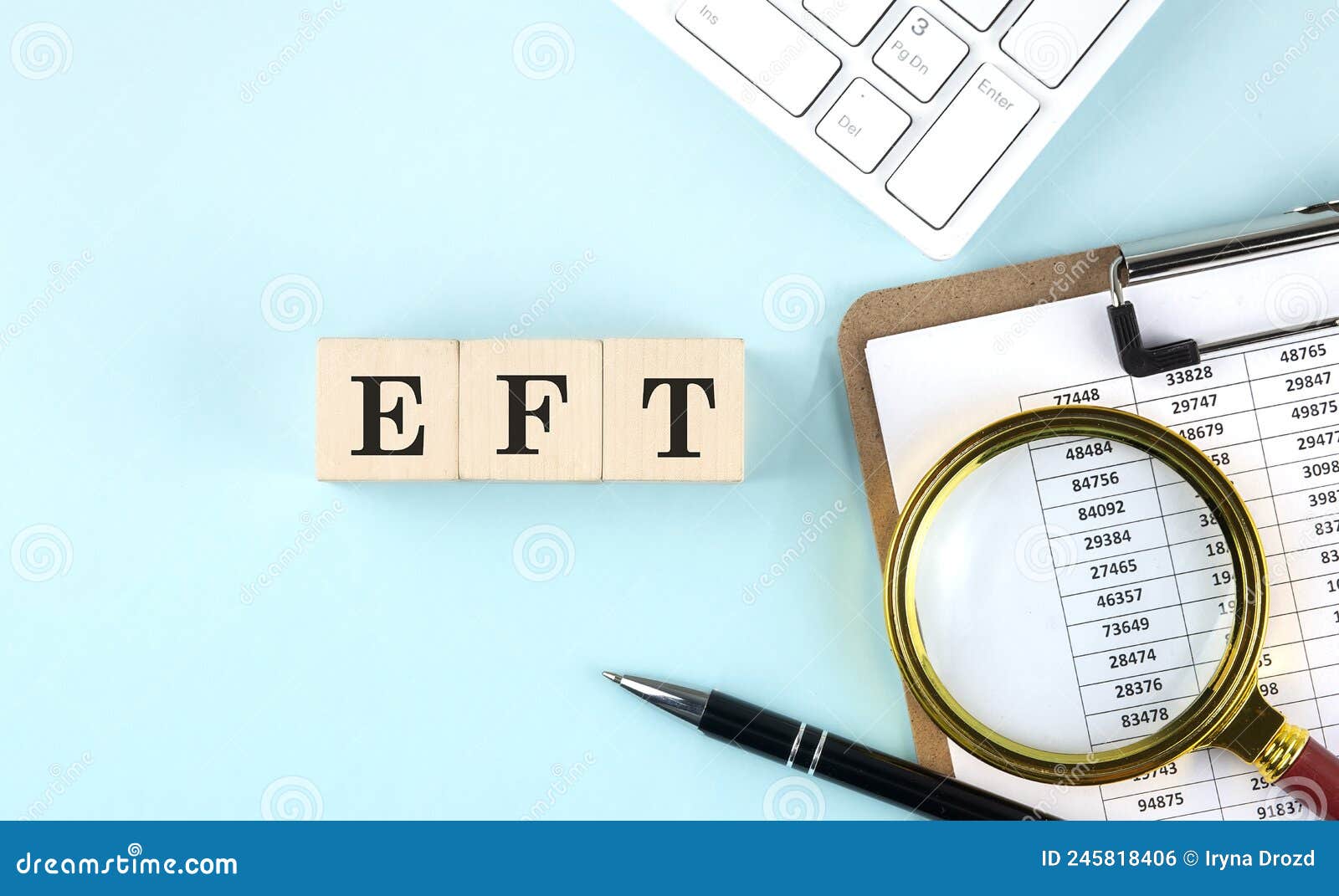 EFT Word on Wooden Cubes on Blue Background with Chart and Keyboard ...