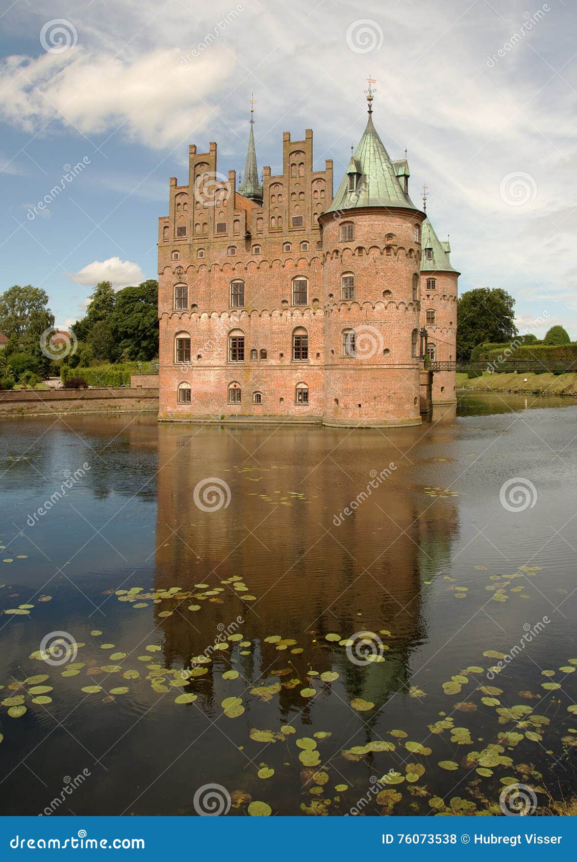 Egeskov castle in Denmark stock photo. Image of clouds - 76073538