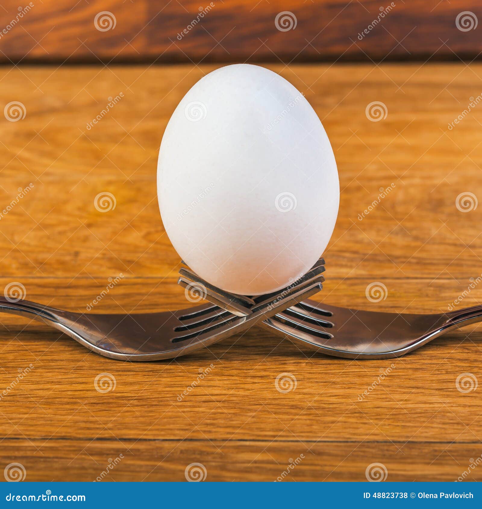 Egg balancing by two forks stock photo. Image of balancing - 48823738