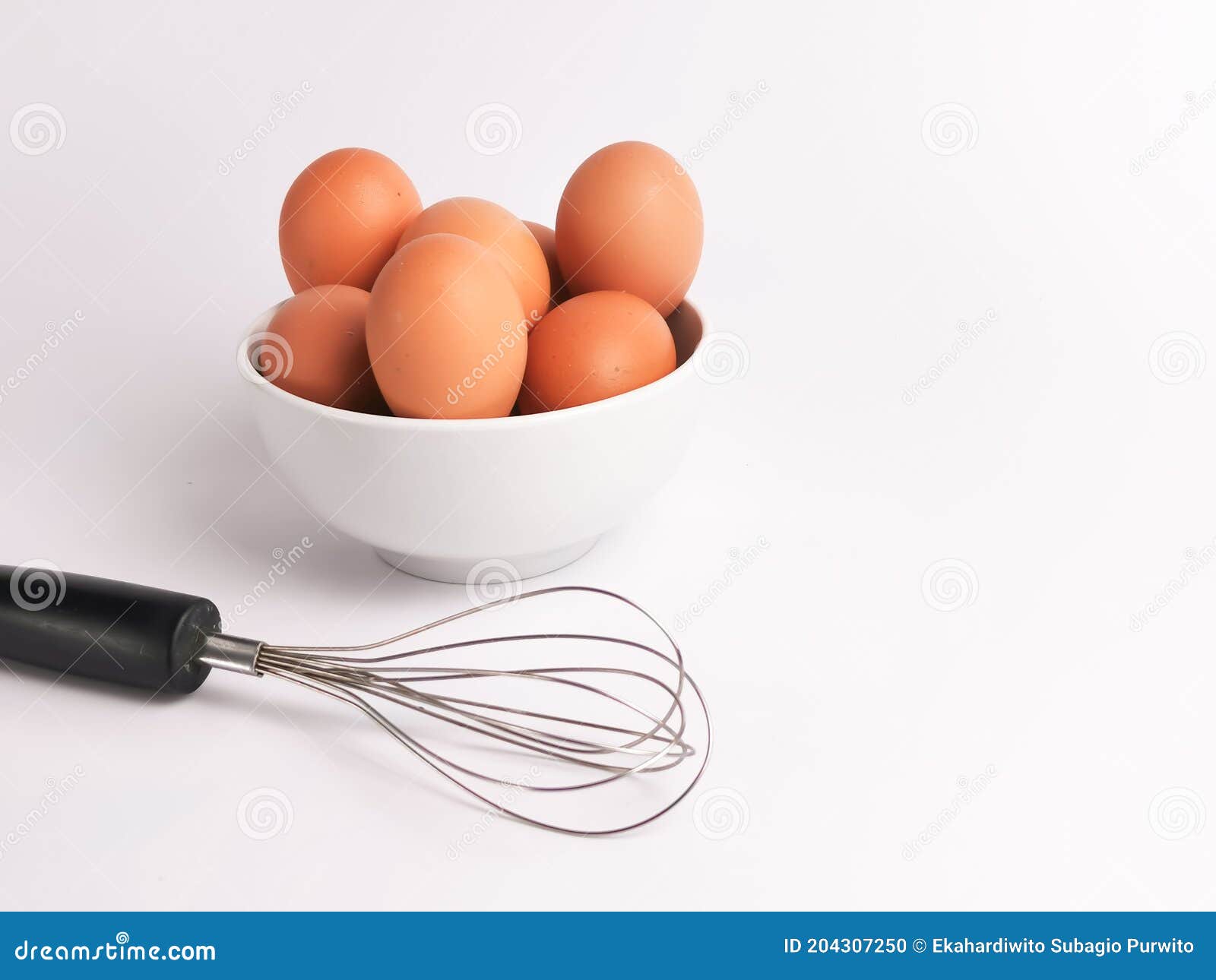 Egg Beater with Chicken Eggs in a Bowl Isolated on White Background ...