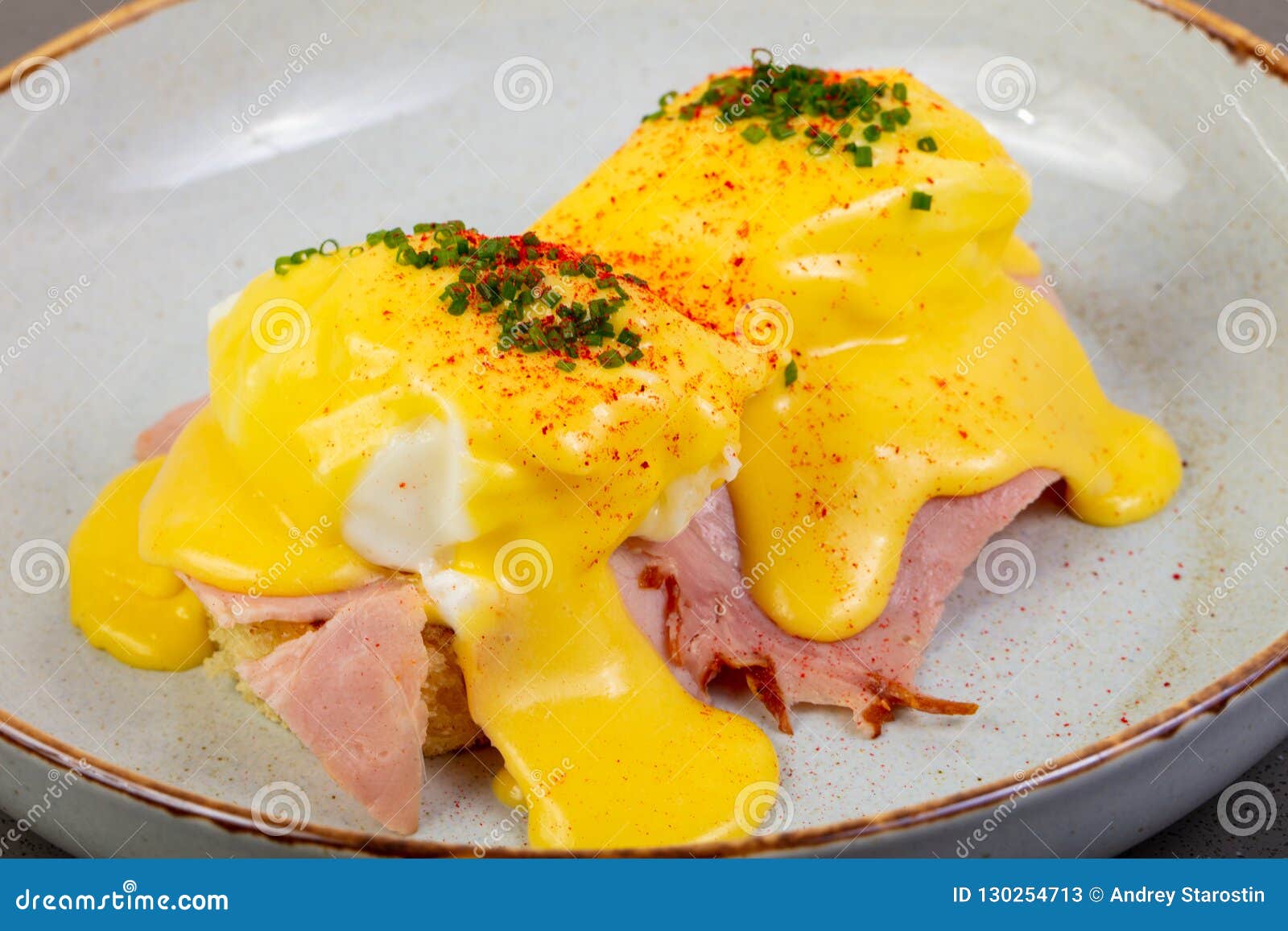 Egg Benedict with cheese stock image. Image of cheese - 130254713