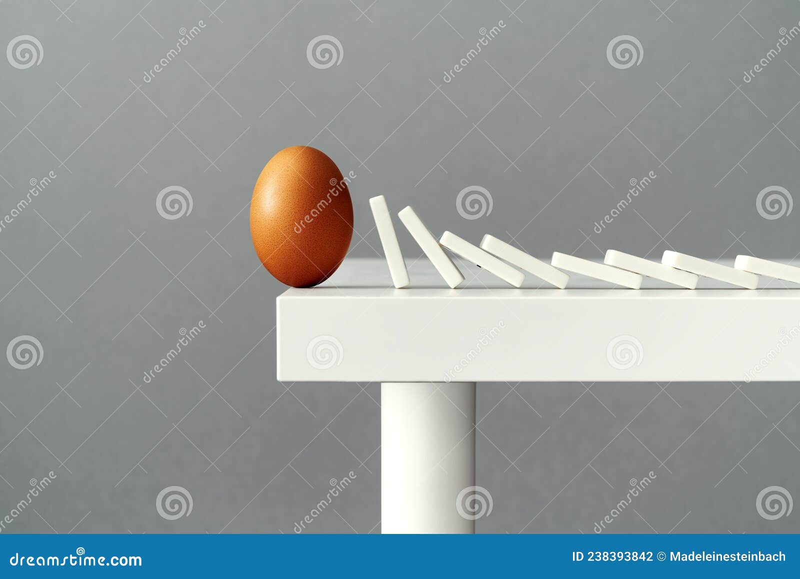 Egg on the Edge of a Table about To Fall Due To Domino Tiles Pushing ...