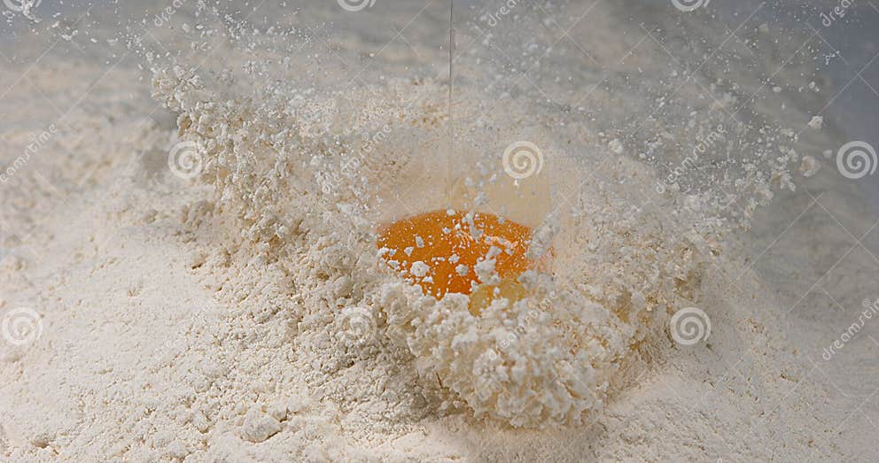 Egg Falling on Flour stock photo. Image of food, healthy - 289193256