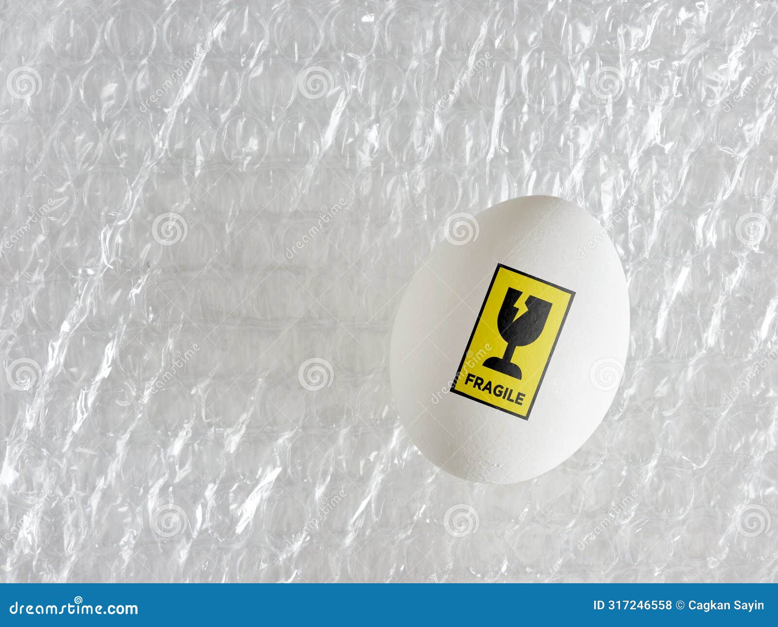 Egg with Fragile Sticker on a Bubble Wrap Stock Photo - Image of ...