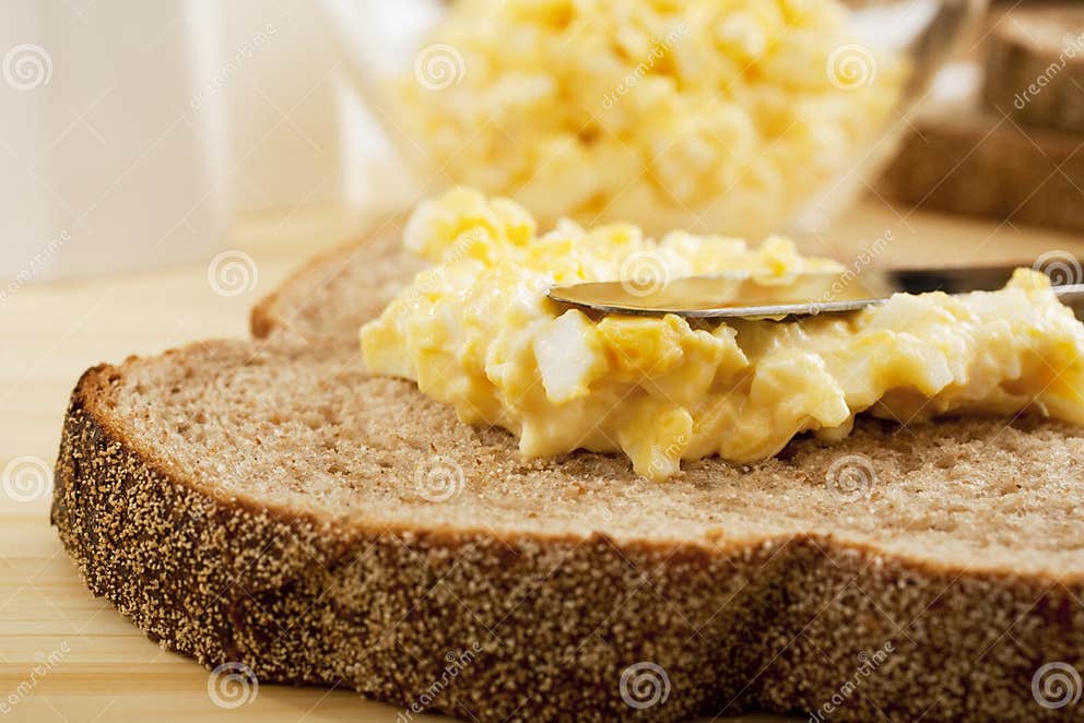 Egg Mayonnaise Being Spread on Bread Stock Photo - Image of closeup ...