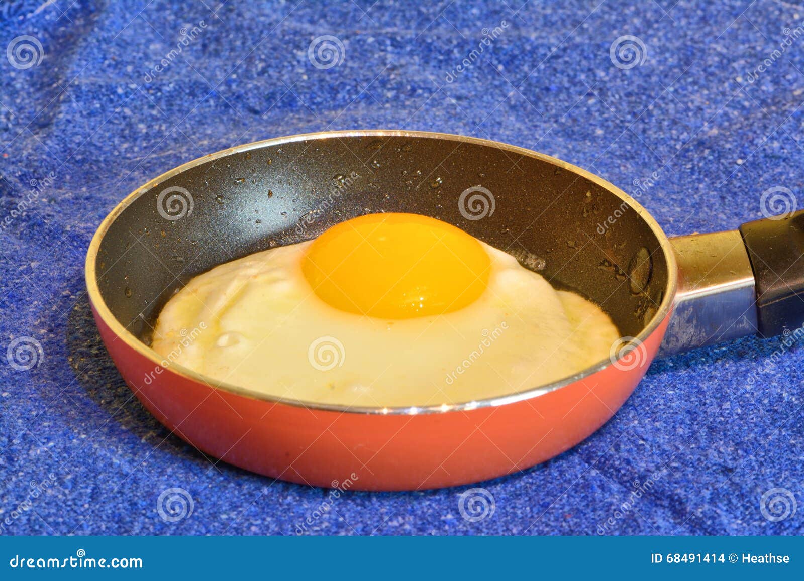 Egg in mini frying pan stock photo. Image of single, small - 68491414