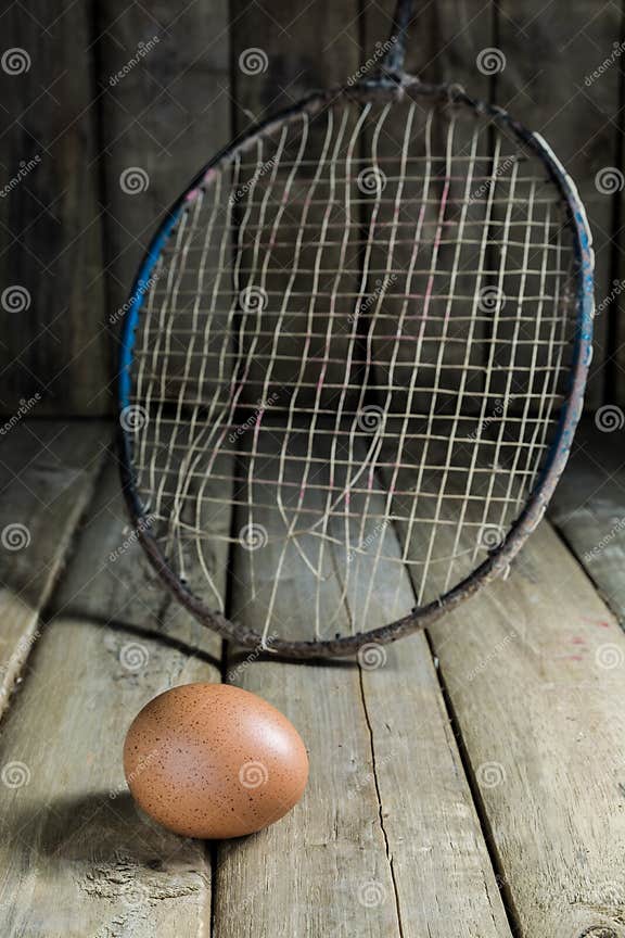 Egg and Old Badminton Racket on Wood Table Stock Photo - Image of ...
