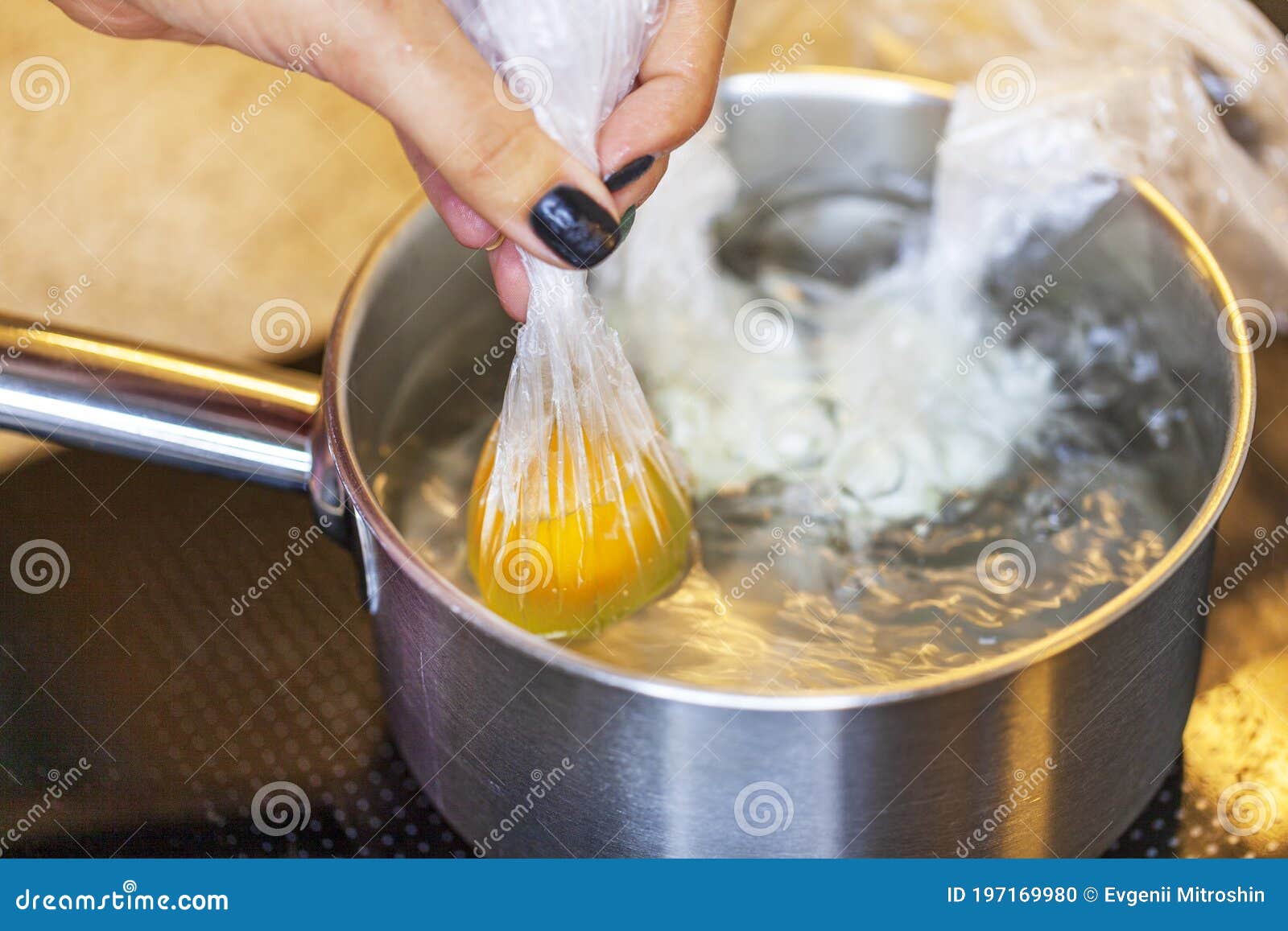 Egg poaching in water stock photo. Image of fine, healthy - 197169980