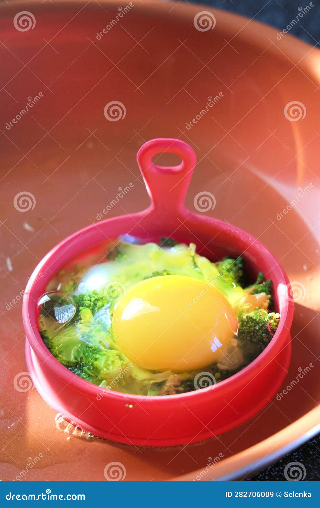 Egg Roasted with Broccoli in Silicone Mold on a Frying Pan Stock Image ...