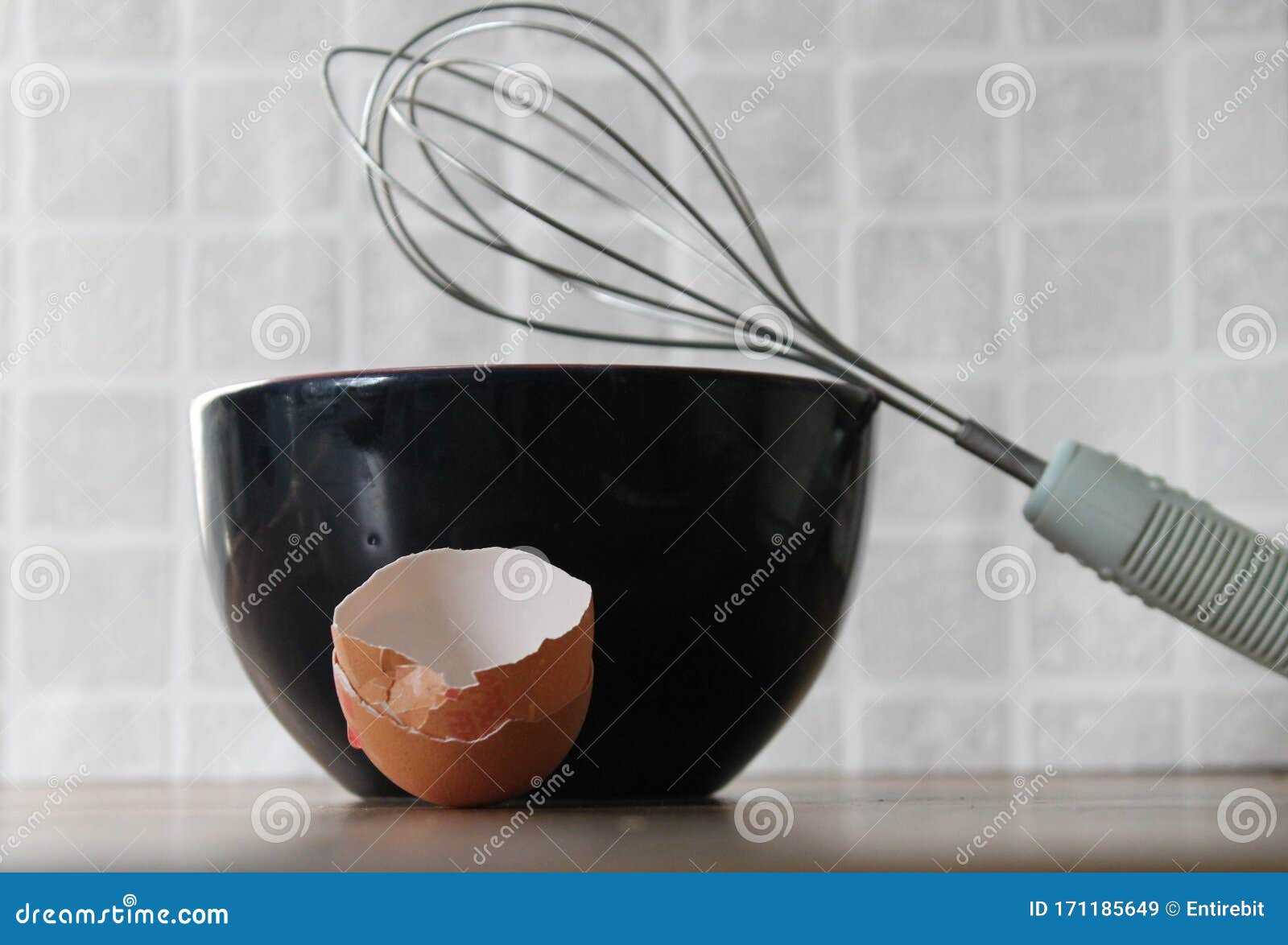 Egg Shell and Bowl with Whisk in a Tiled Kitchen Stock Image - Image of ...