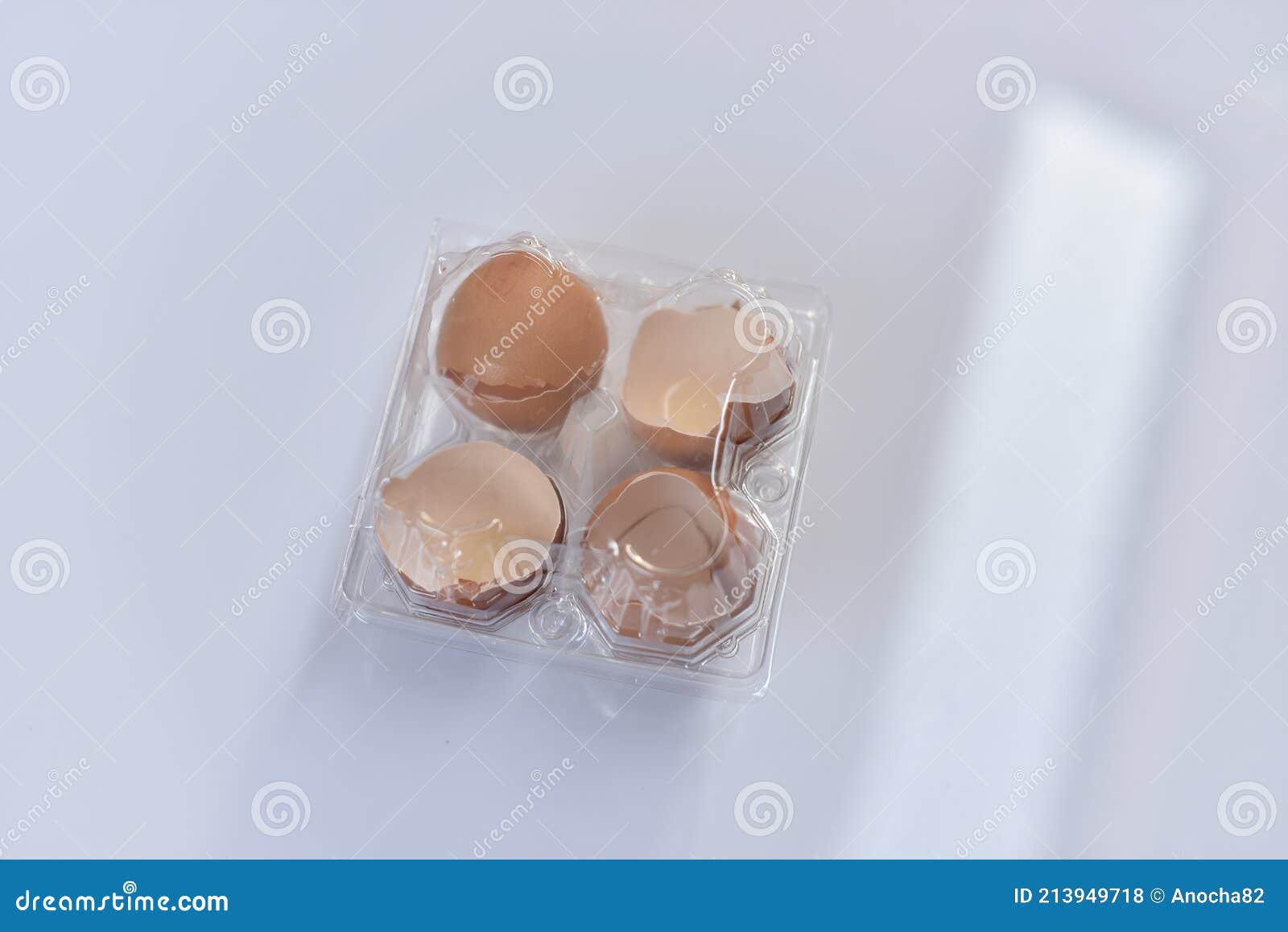 Egg Shell and Plastic Box on a White Background Stock Photo - Image of ...