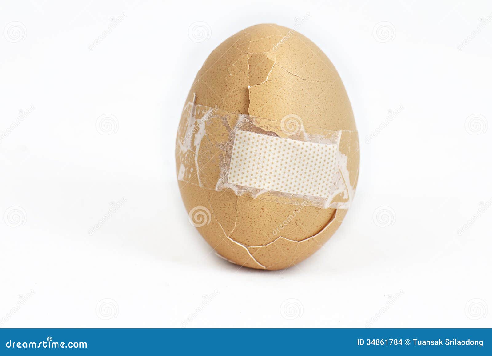 Egg with sticking plaster stock photo. Image of injury - 34861784