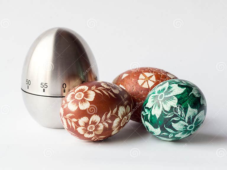 Egg timer and easter eggs stock photo. Image of food - 140220012