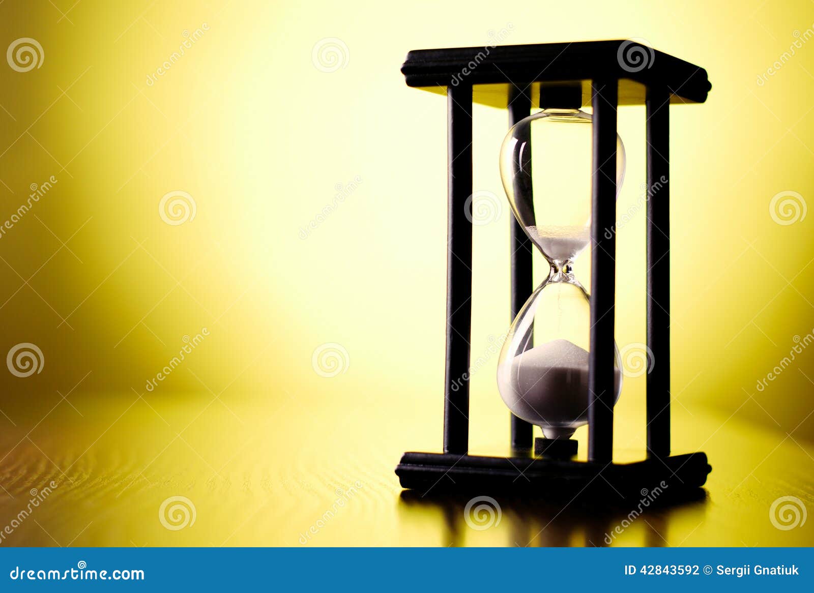 Egg Timer or Hourglass on a Yellow Background Stock Photo - Image of ...