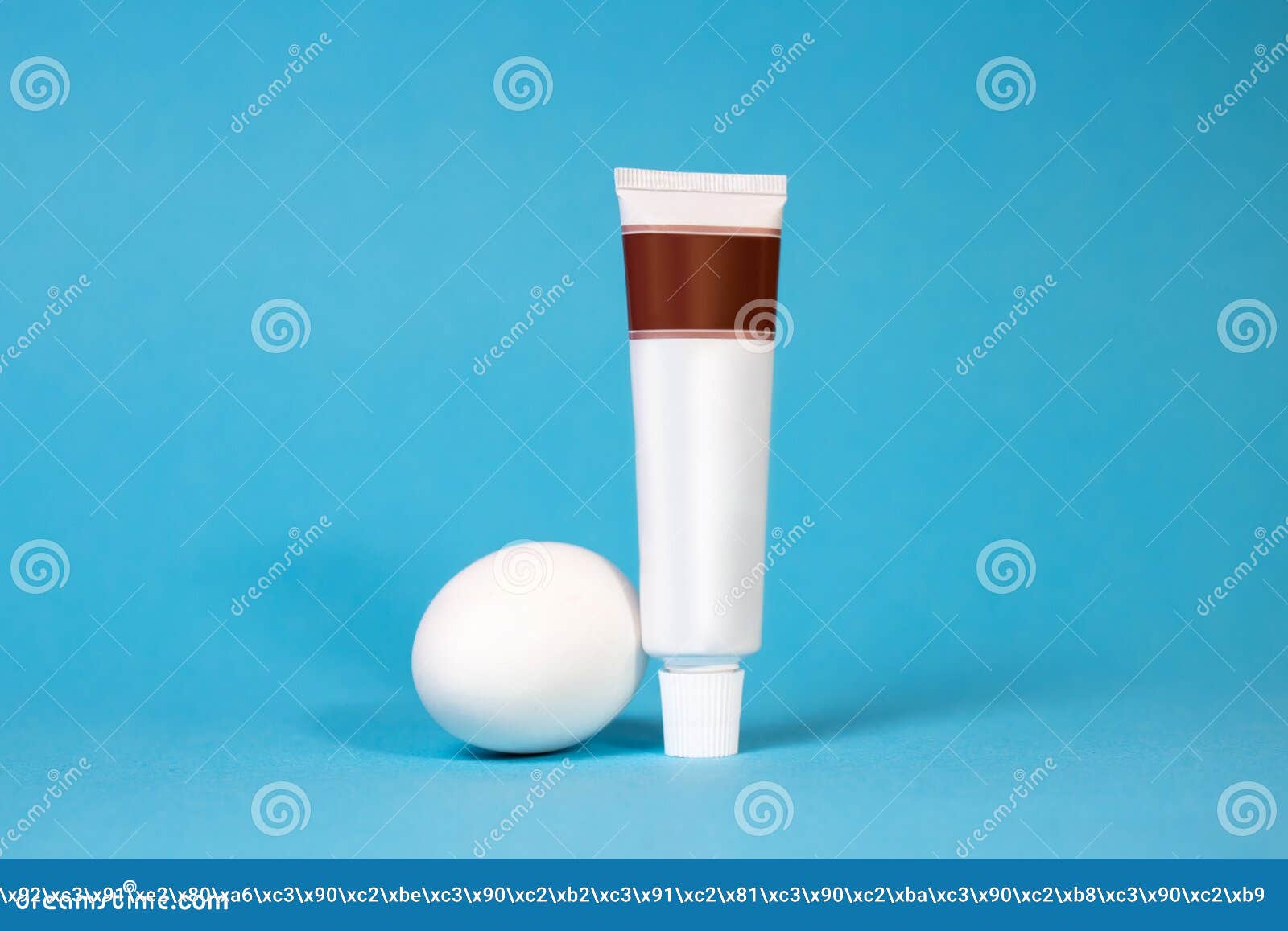 An Egg and a Tube of Toothpaste without a Logo on a Blue Background ...