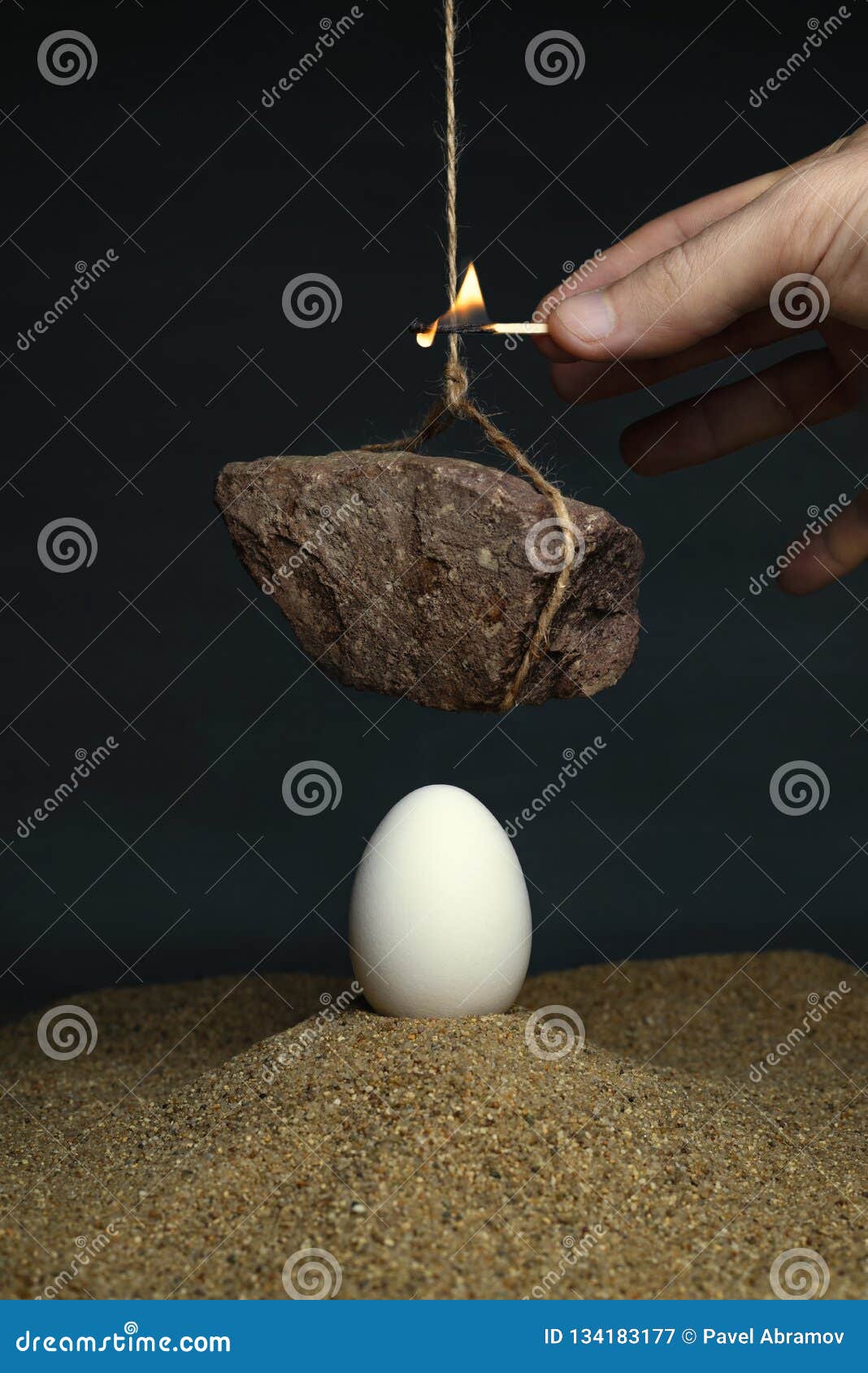 Egg Under a Stone Hanging on a Rope Stock Image - Image of dangerous ...