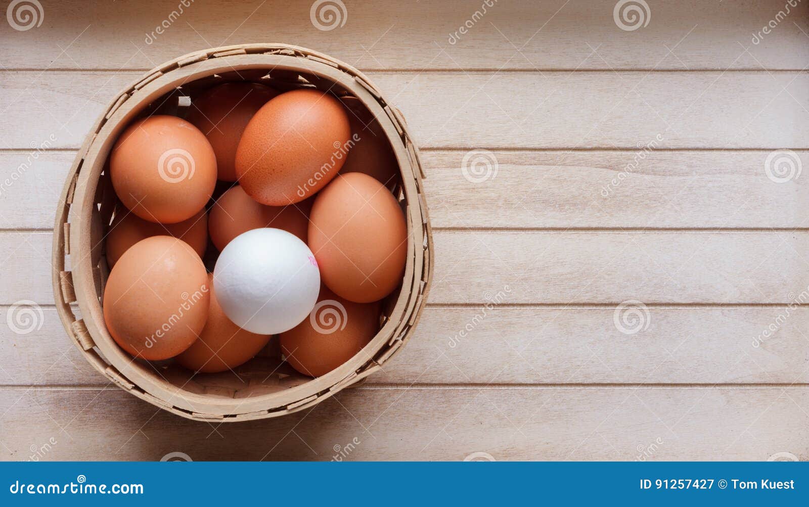Eggs in a Basket - One Different Stock Image - Image of social, wooden ...