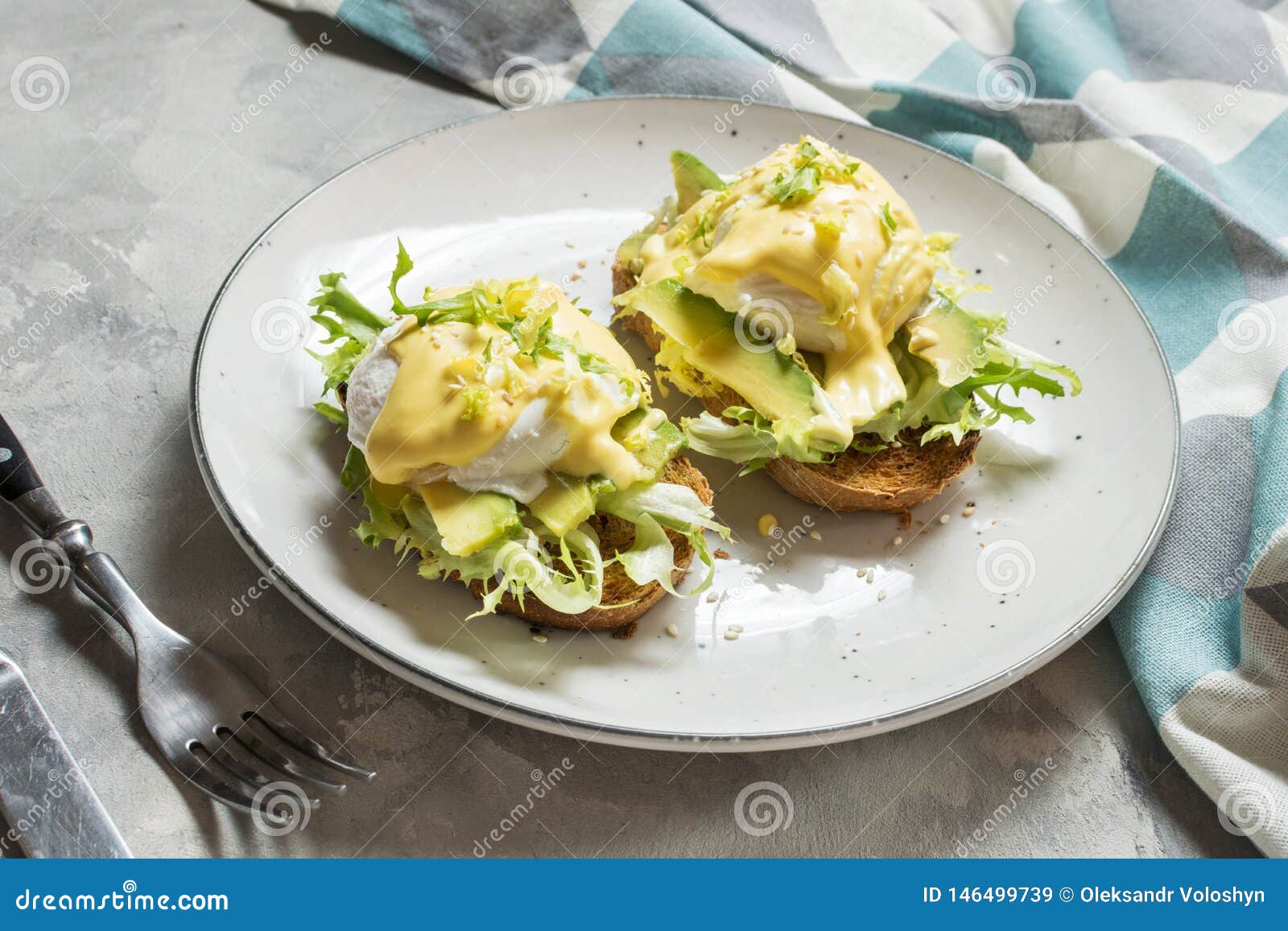 Eggs Benedict with Avocado on Concrete Background Stock Image - Image ...