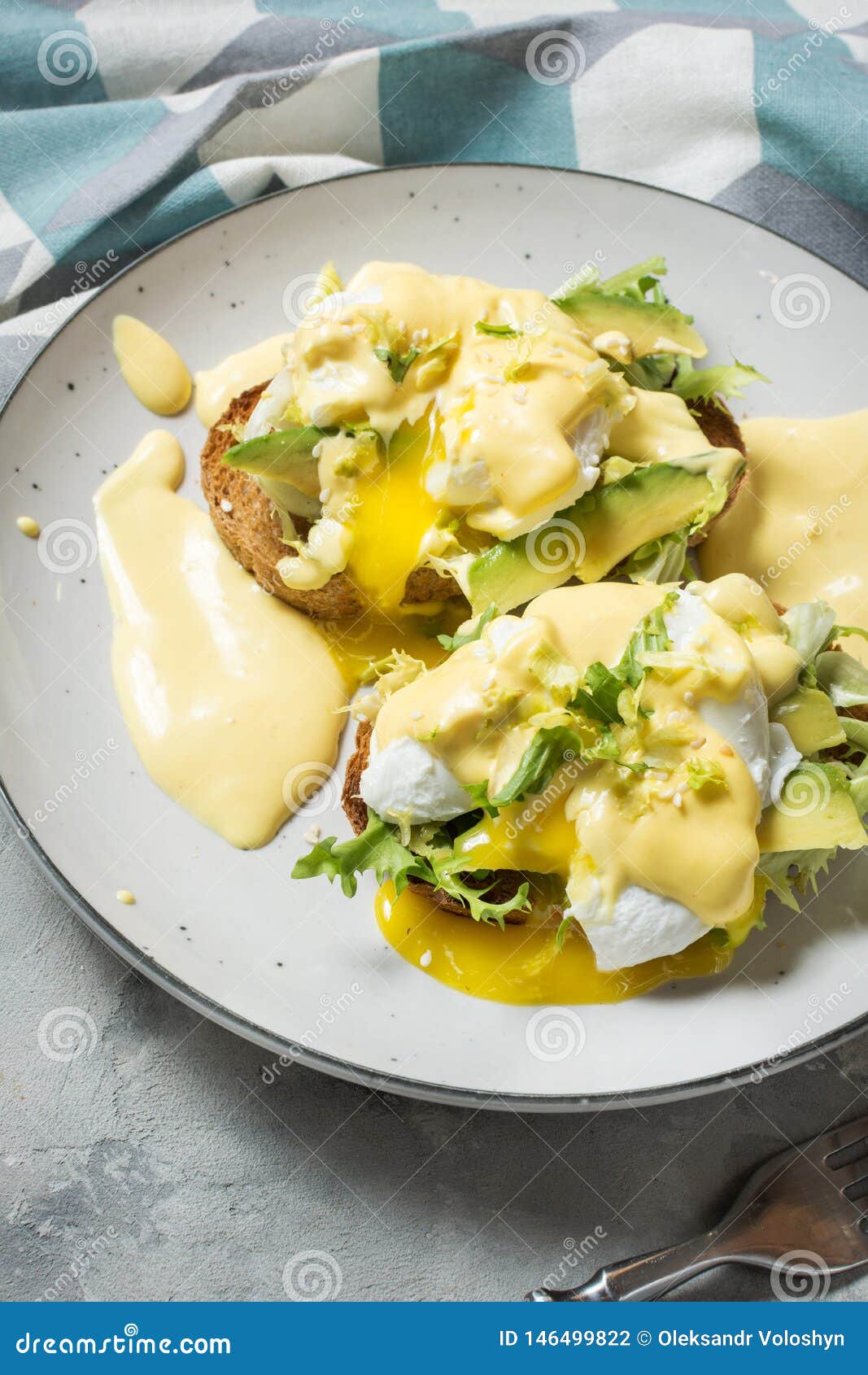Eggs Benedict with Avocado on Concrete Background Stock Photo - Image ...