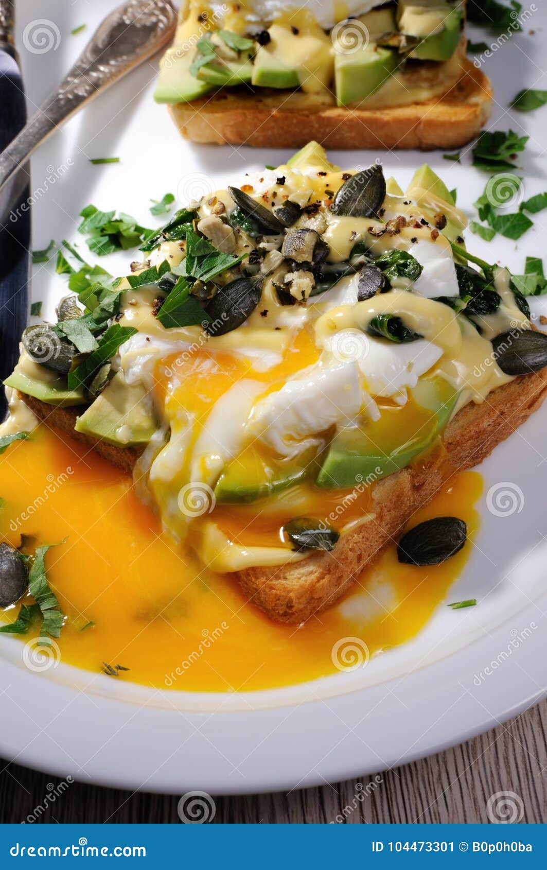 Eggs Benedict with Avocado on Toast Stock Image - Image of elevenses ...