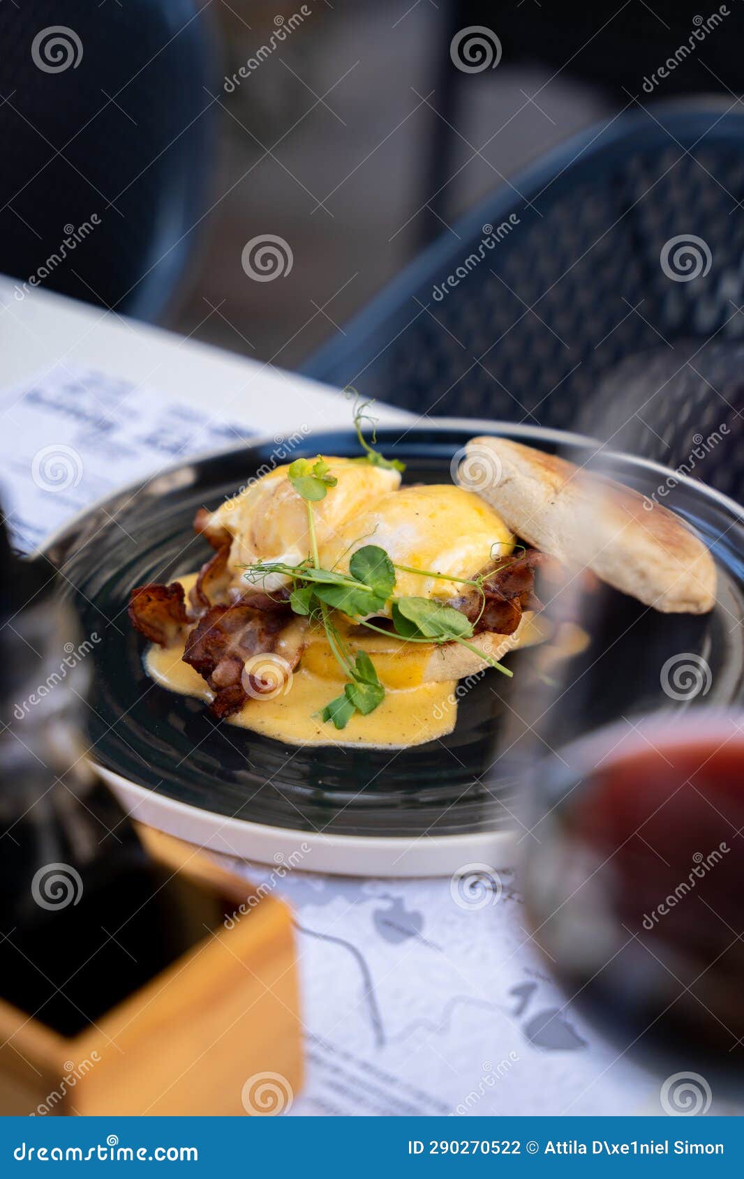 Eggs Benedict with Bacon and Ham Outside at a Brunch Stock Photo ...