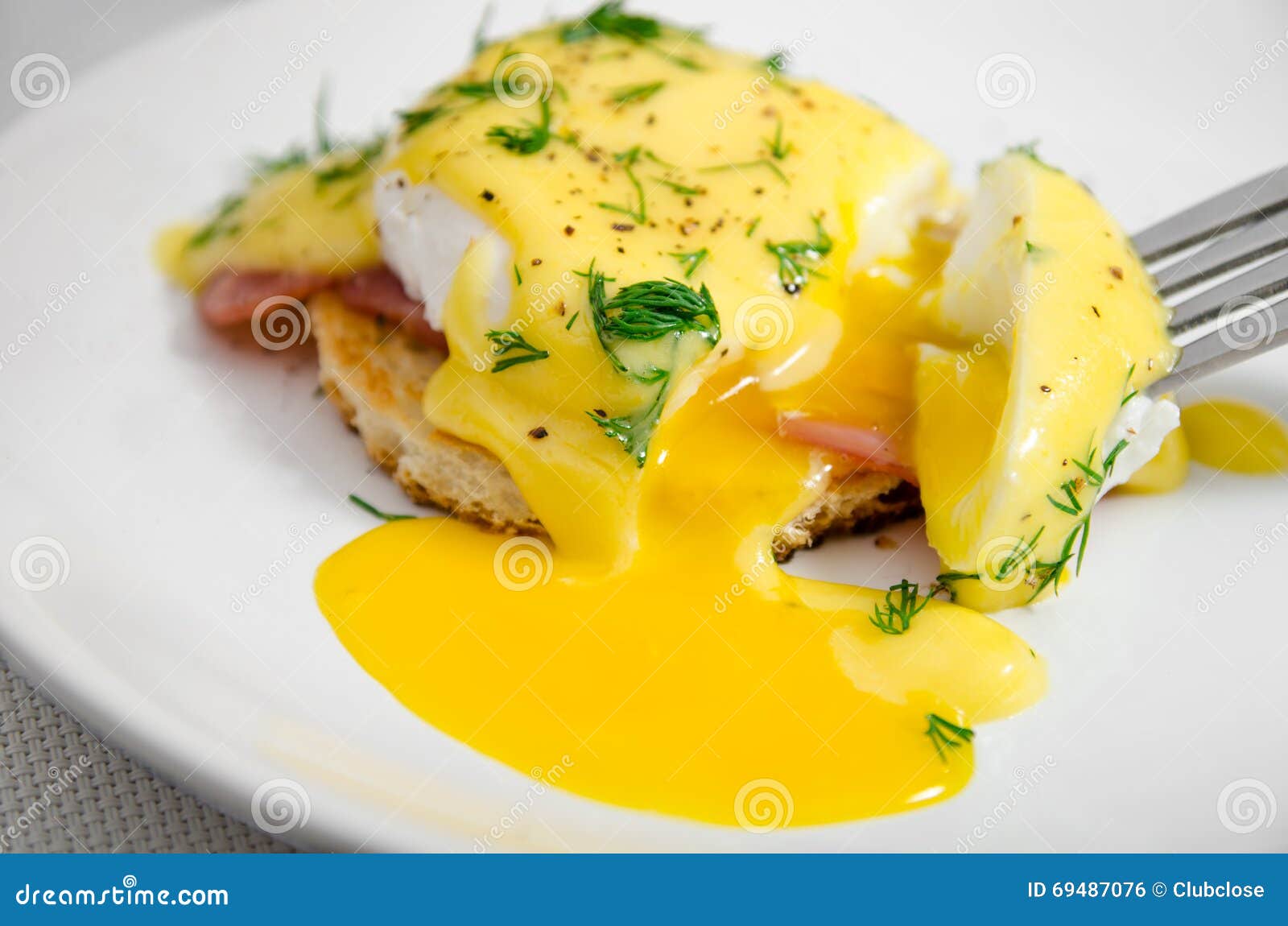 Eggs Benedict for Breakfast on a White Plate, Liquid Yolk Stock Photo ...